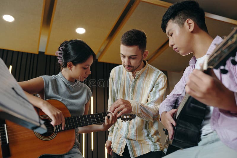 Teaching Guitar Techniques in Music Classroom Session Stock Image ...
