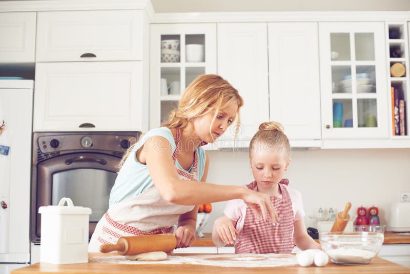 Teaching Her the Basics of Baking. Cute Little Girl Baking in the ...