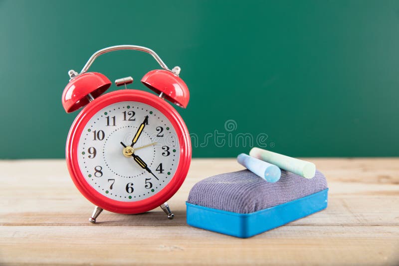 Teaching a Red Alarm Clock and a Blackboard Eraser in Front of the ...