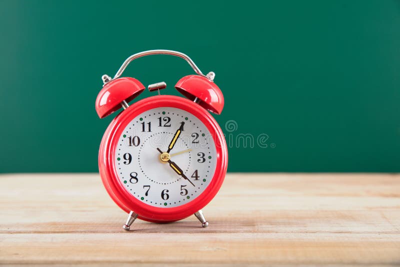 Teaching a Red Alarm Clock in Front of Blackboard Stock Photo - Image ...