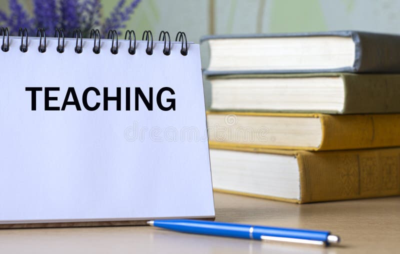 TEACHING - a Word in a Notebook Against the Background of Old Books ...