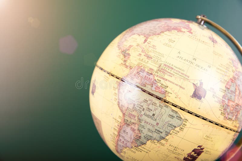 Teaching a Yellow Globe in Front of Blackboard Stock Photo - Image of ...