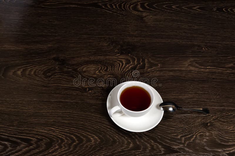 A Teacup with Tea on the Table Stock Image - Image of wooden, liquid ...