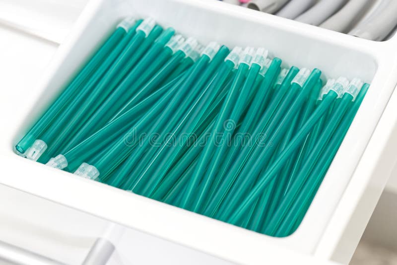 Teal Plastic Tubes in a White Container Stock Photo - Image of business ...