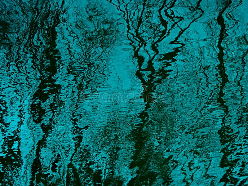 Teal Rippling Water Surface with Reflections of Bare Trees and Sky ...