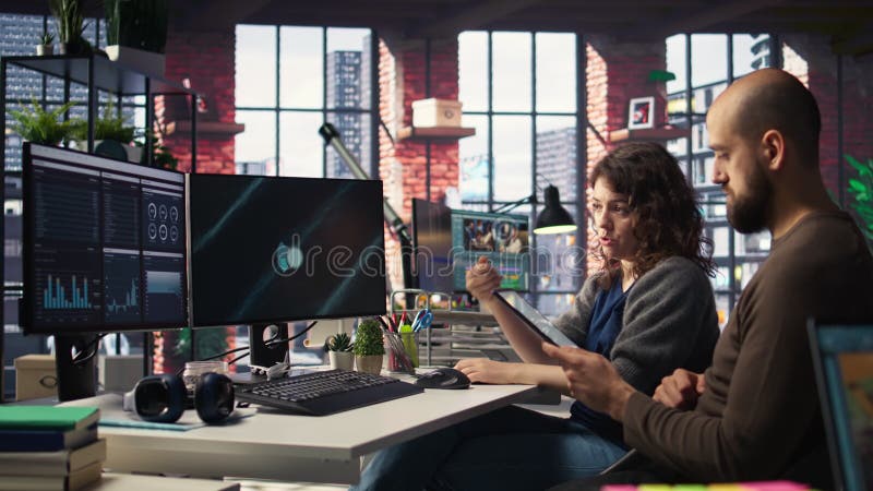 Team of Analysts Examining Presentation Charts and Data on Dashboard ...