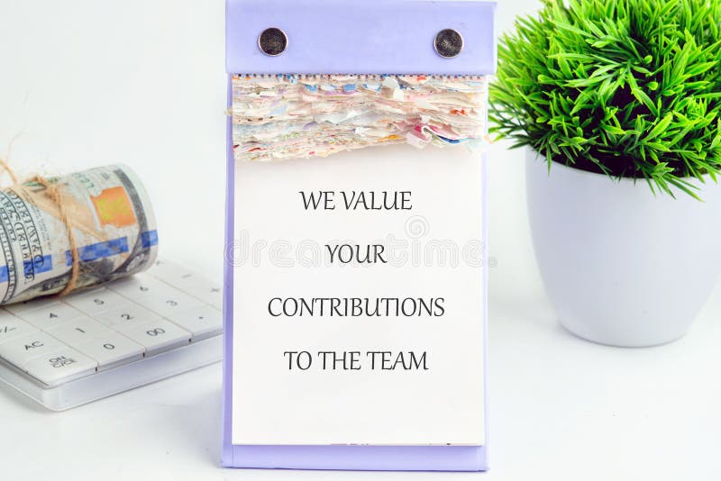 Team Appreciation Note Highlighting Contributions on a Desk with Money ...