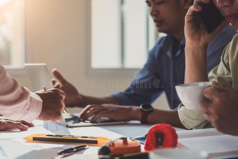 Architect or Engineer Team Working with Blueprints Building Plan Design ...