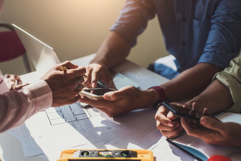 Architect or Engineer Team Working with Blueprints Building Plan Design ...