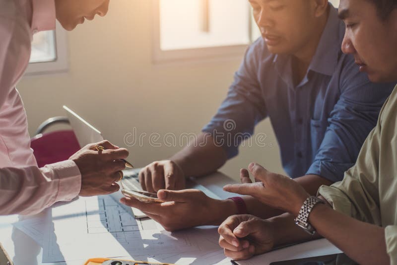 Team Architect Engineer Design Discussing with Blueprint on Table in ...