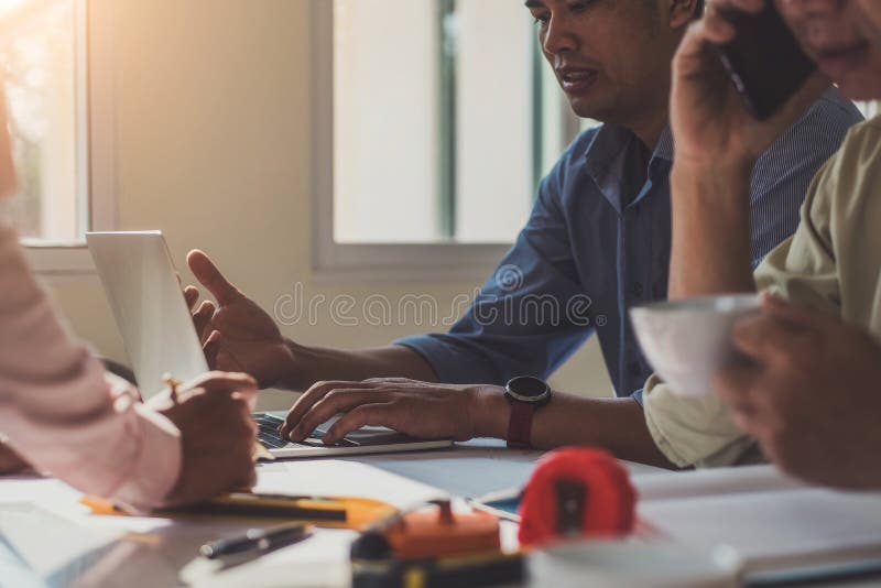 Team Architect Engineer Design Discussing with Blueprint on Table in ...