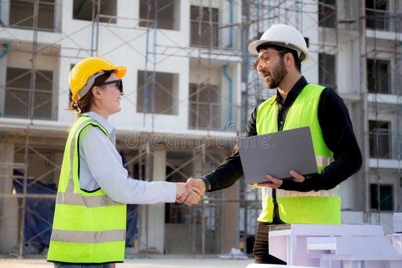 Team Architect or Engineer Holding Laptop Looking Model House and Doing ...