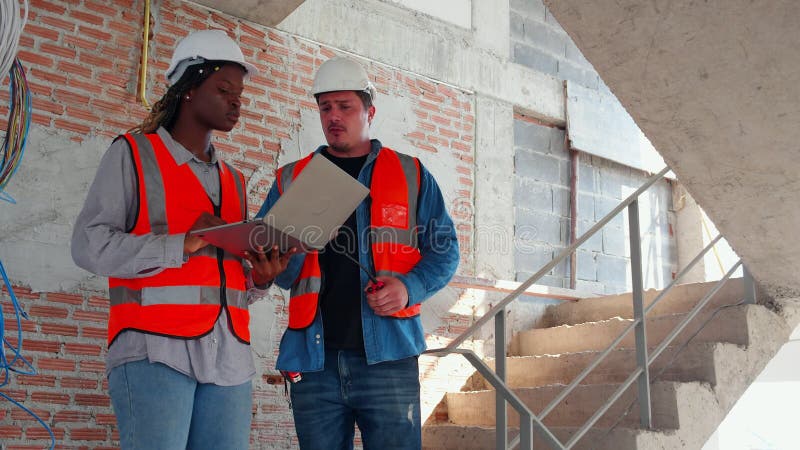 Team of Architect or Engineer Looking Laptop Computer for Inspection ...