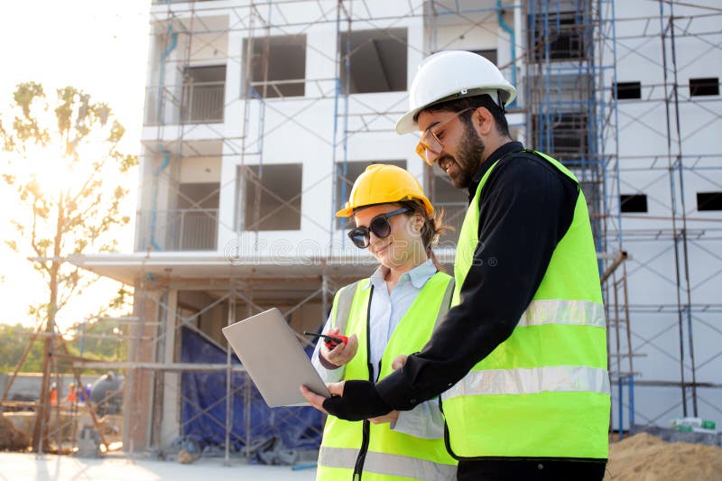 Team of Architect or Engineer Looking Laptop for Inspection and ...