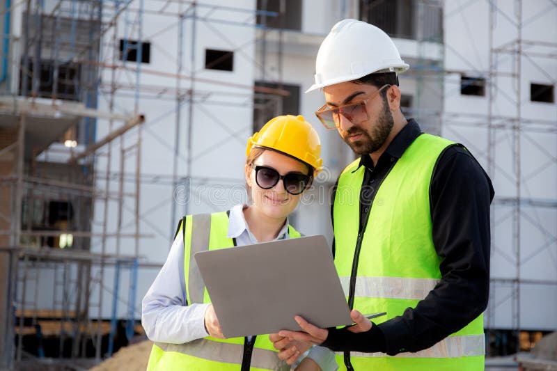 Team of Architect or Engineer Looking Laptop for Inspection and ...