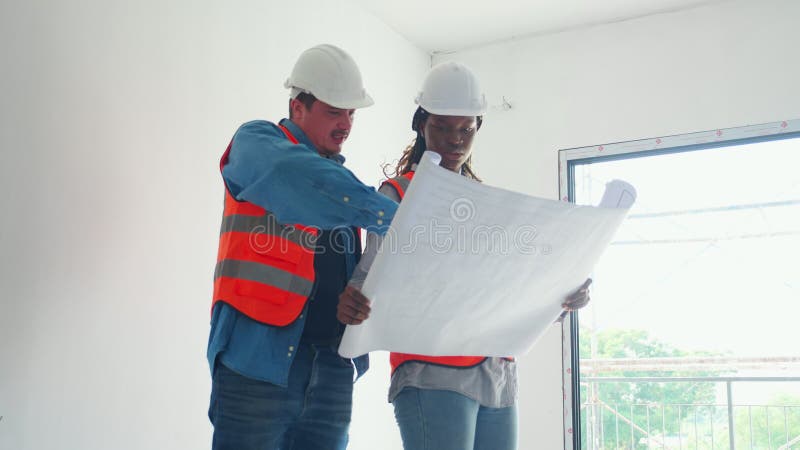 Team of Architect or Engineer Wearing Hardhat Looking Blueprint for ...