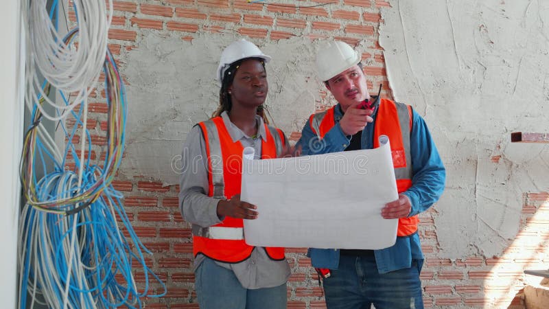 Team of Architect or Engineer Wearing Hardhat Looking Blueprint for ...