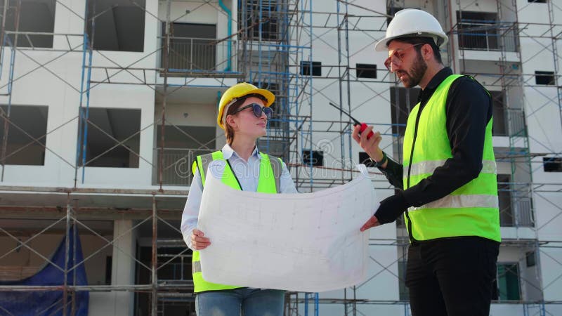Team of Architect or Engineer Wearing Hardhat Looking Blueprint for ...
