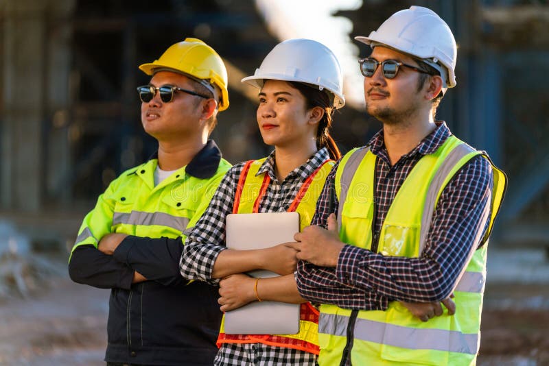 A Team of Architects, Civil Engineers, Engineers, Diversity Standing ...