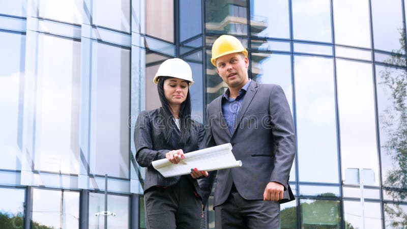 Team of Architects and Engineer in Group on Construciton Site Check ...