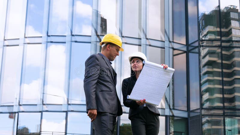 Team of Architects and Engineer in Group on Construciton Site Check ...