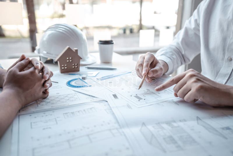 Team of Architects or Engineering Consulting and Analyzing Working on ...