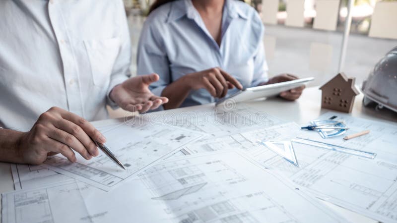 Team of Architects or Engineering Consulting and Analyzing Working on ...