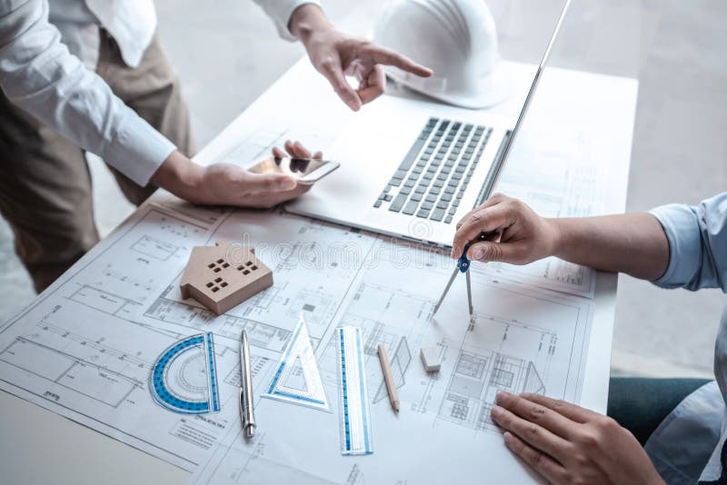 Team of Architects or Engineering Consulting and Analyzing Working on ...