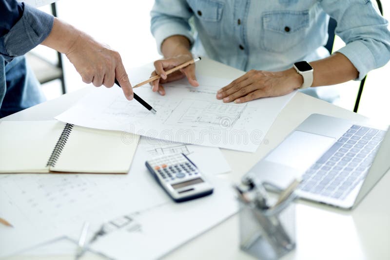 A Team of Architects or Engineers is Consulting with Each Other Stock ...