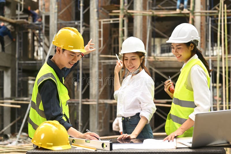 Team of Architects and Executive Supervisor Discussing Project Details ...