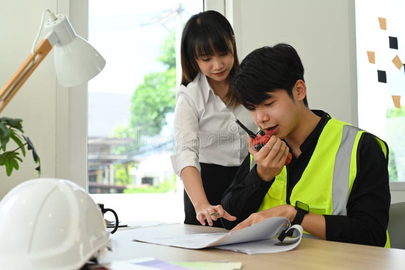 Team of Architects and Inspectors Supervising Progress of Construction ...