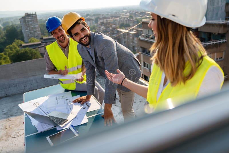 Team of Architects People in Group on Construciton Site Check Documents ...