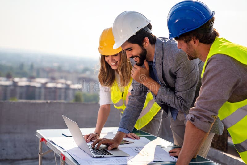 Team of Architects People in Group on Construciton Site Check Documents ...
