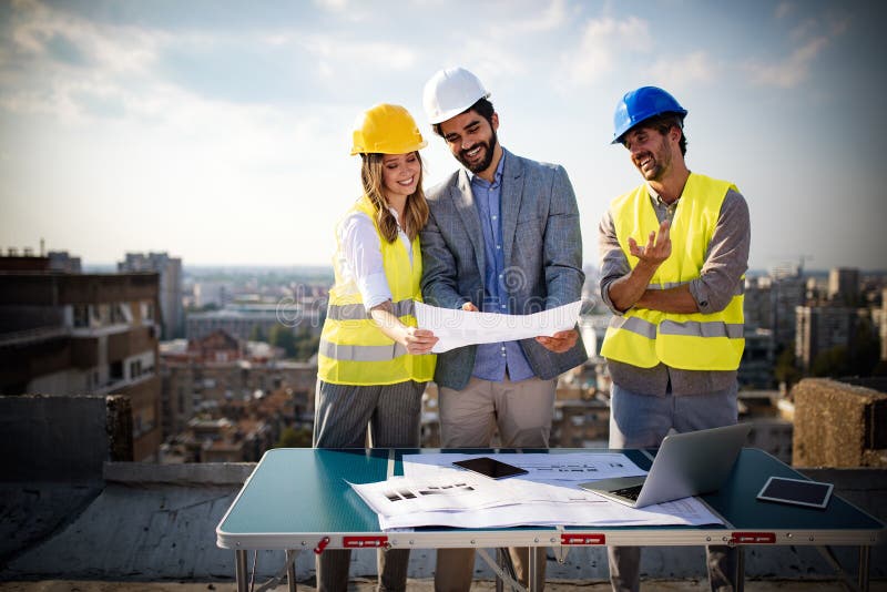 Team of Architects People in Group on Construciton Site Check Documents ...