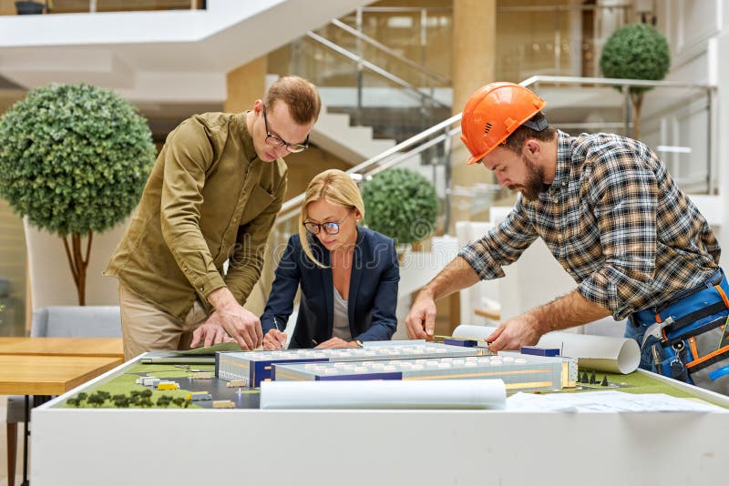 Team of Architects Plan Complex Building Model, Construction Stock ...
