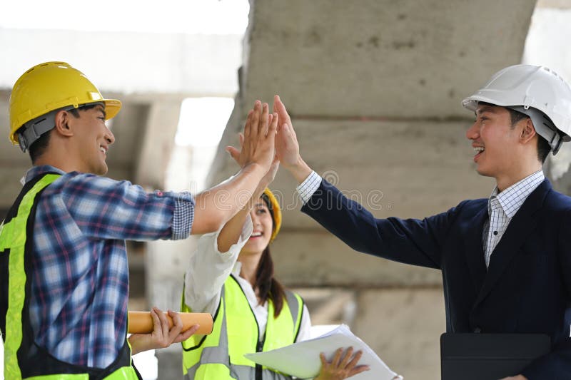 Team of Architects or Structural Engineers Giving High Five and ...