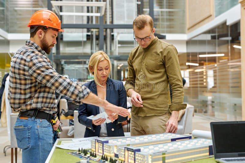 Team of Architectural Engineers Artists Creating Design with Scale ...