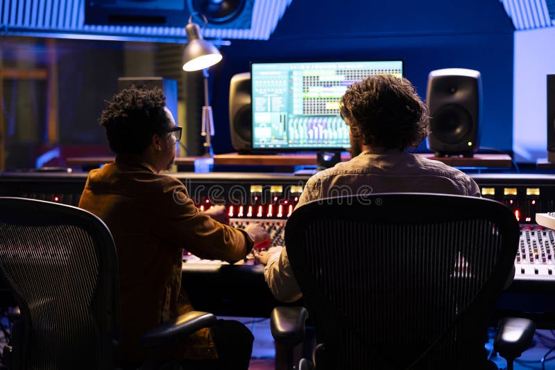 Team of Artist and Technician Working on Track Recording in Control ...