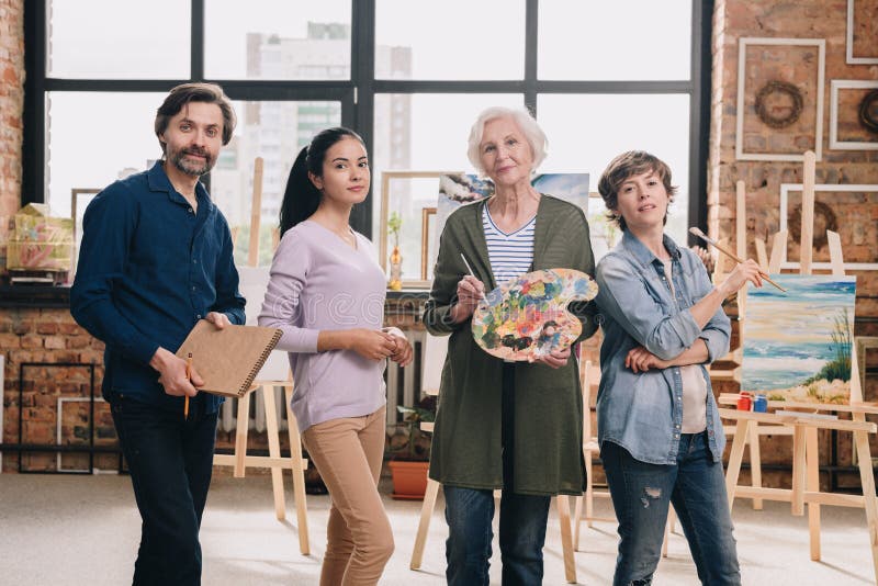Team of Artists Posing in Studio Stock Image - Image of studio ...