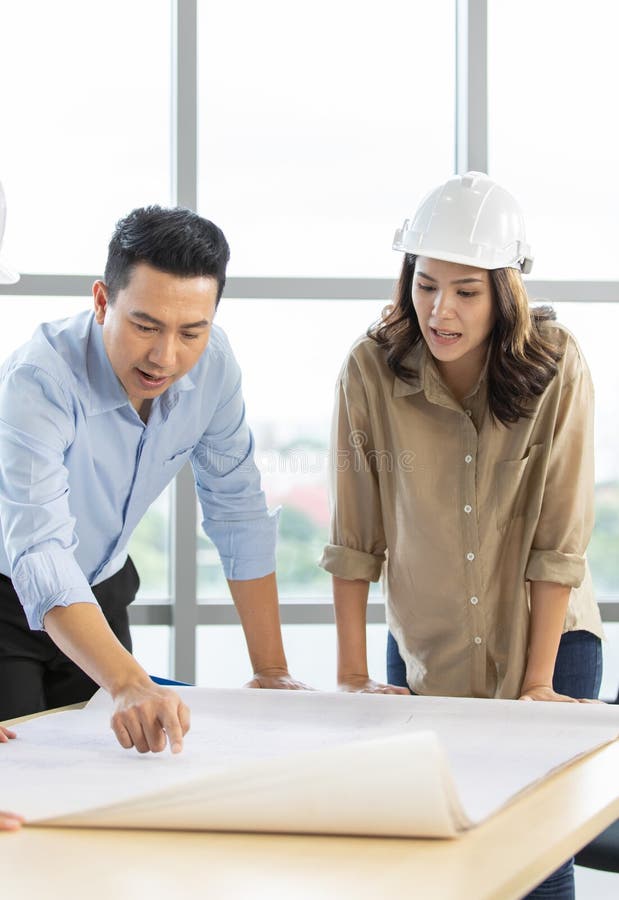 Team of Asian Engineers Team, Man and Woman, Talking and Discussing a ...