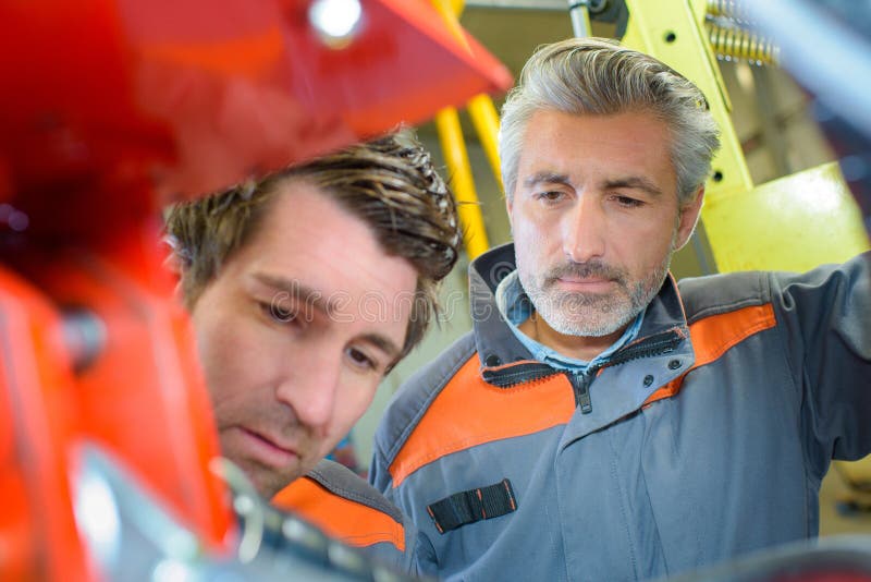 Team 2 Assembling Components Stock Image - Image of manual, vocational ...