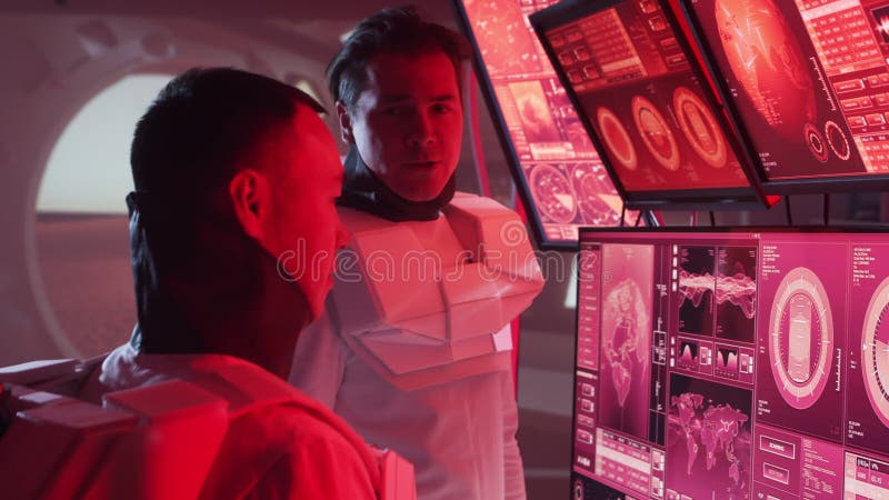 Team of Astronauts in a Space Suits Aboard the Orbital Station. a Crew ...