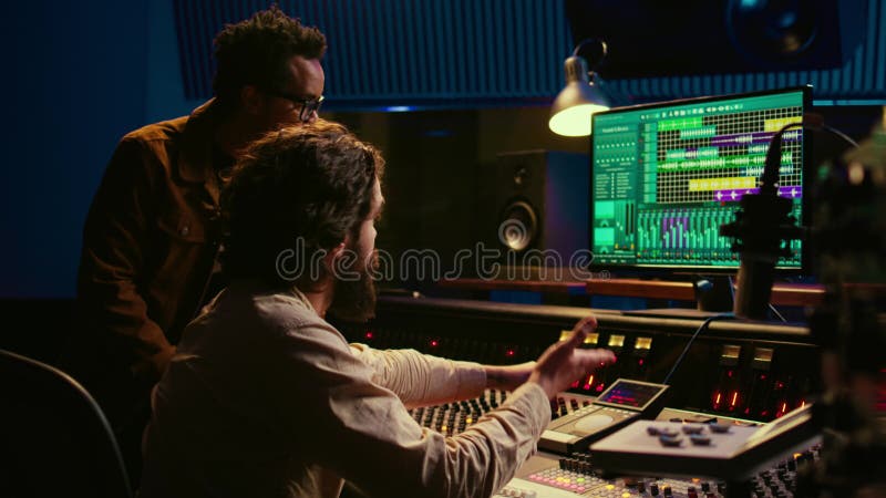 Team of Audio Technician and Artist Producing and Editing Sound on ...