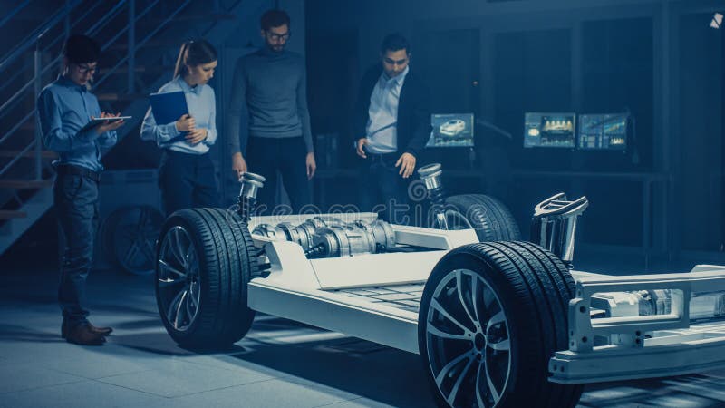 Team of Automotive Engineers Discussing and Designing Electric Car ...