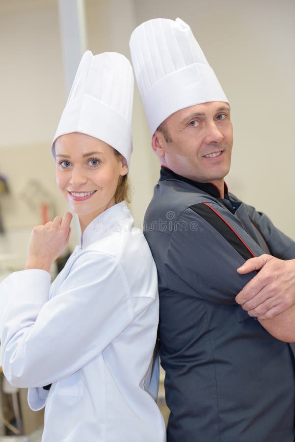 Team Bakers Posing Back To Back and Smiling Stock Photo - Image of ...
