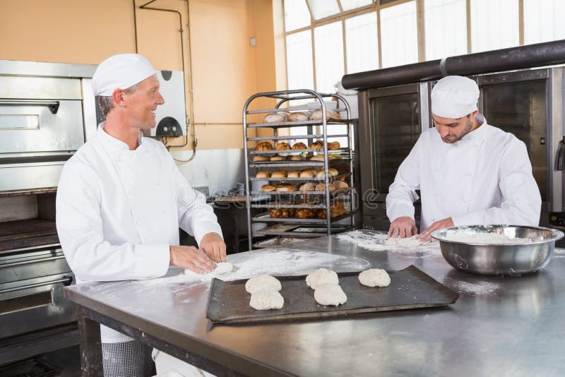 Team of Bakers Preparing Dough Stock Photo - Image of happy, commercial ...