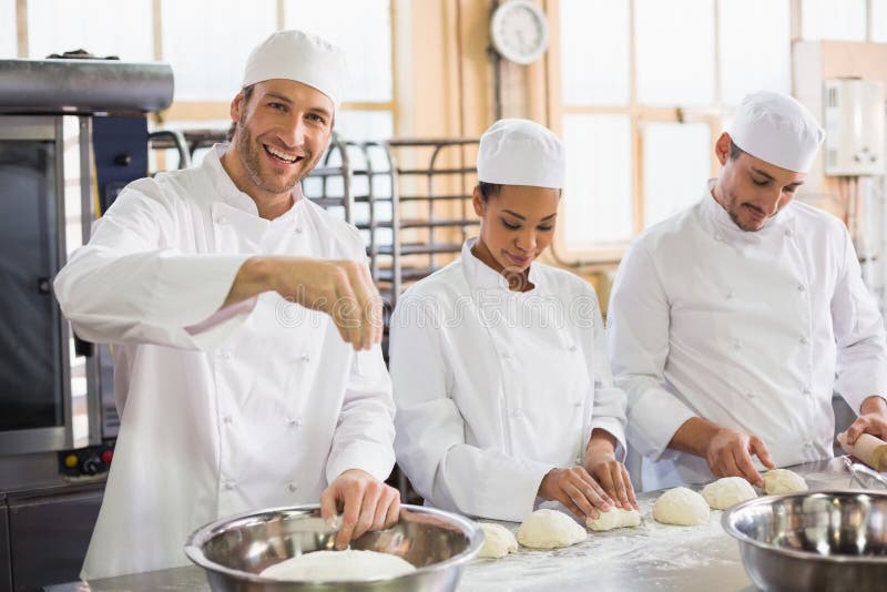 Team of Bakers Preparing Dough Stock Photo - Image of chefs, drink ...