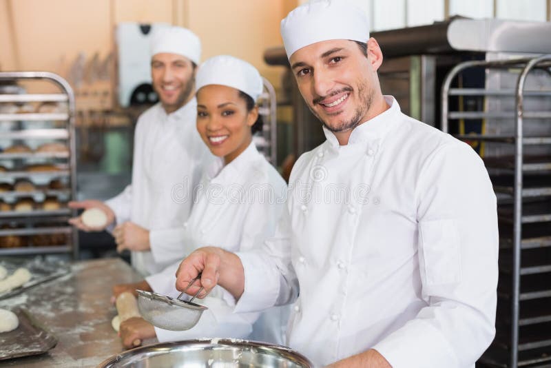 Team of Bakers Smiling at Camera Stock Image - Image of adult, industry ...