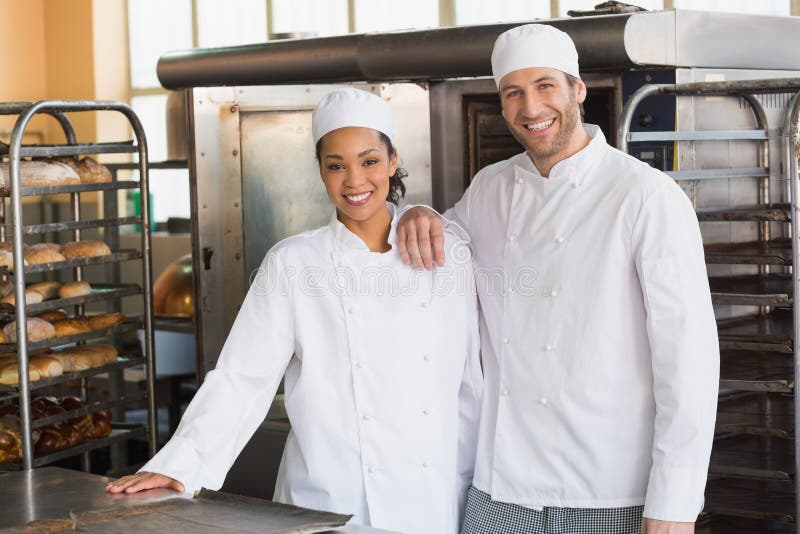 Team of Bakers Smiling at Camera Stock Image - Image of professional ...