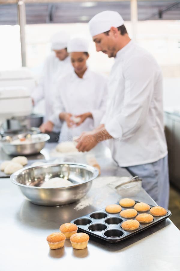 Team of Bakers Working at Counter Stock Image - Image of dough ...